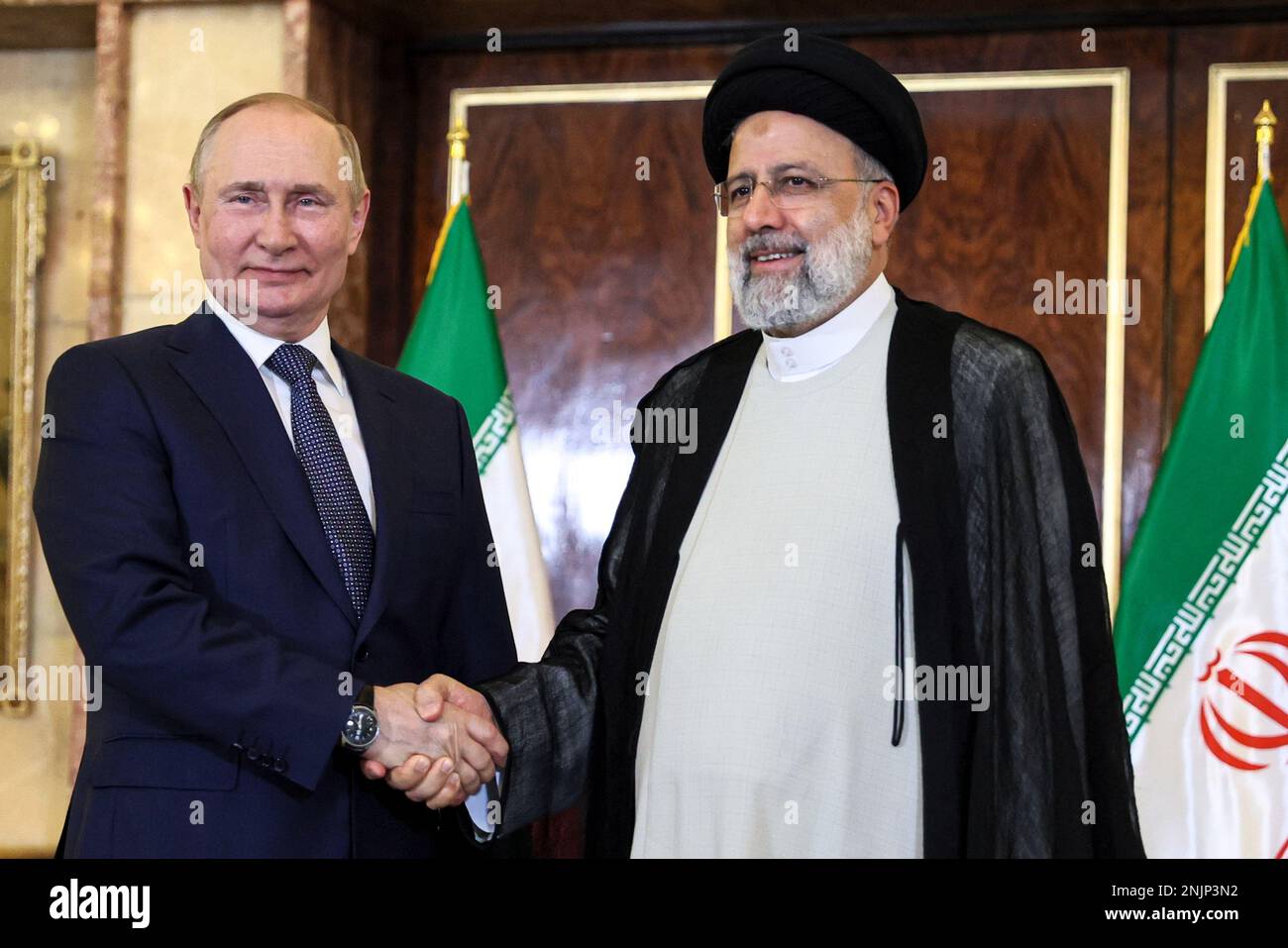 Russian President Vladimir Putin, left, and Iranian President Ebrahim ...
