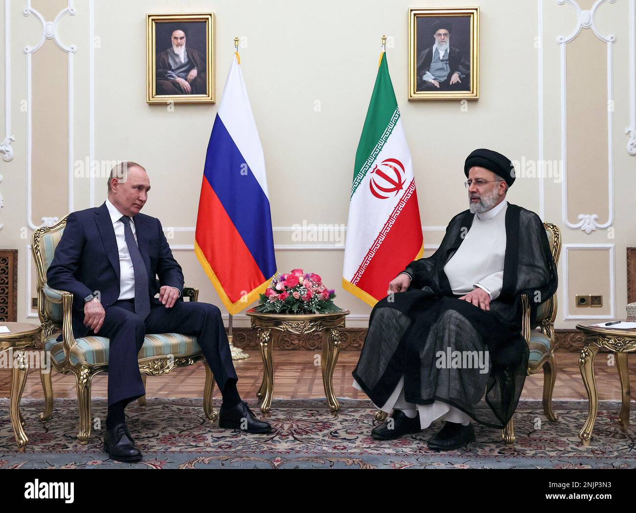 Russian President Vladimir Putin, left, and Iranian President Ebrahim ...