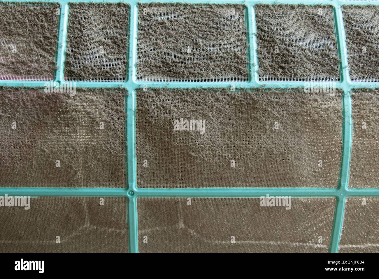 dust on the protective mesh of the air conditioner as a background ...