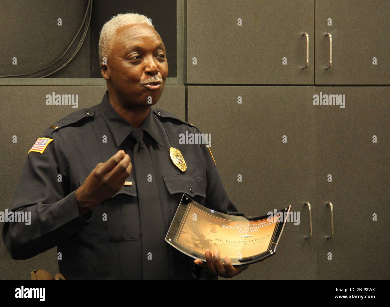 Richard Peterson, a Fort Rucker police officer, speaks after receiving ...