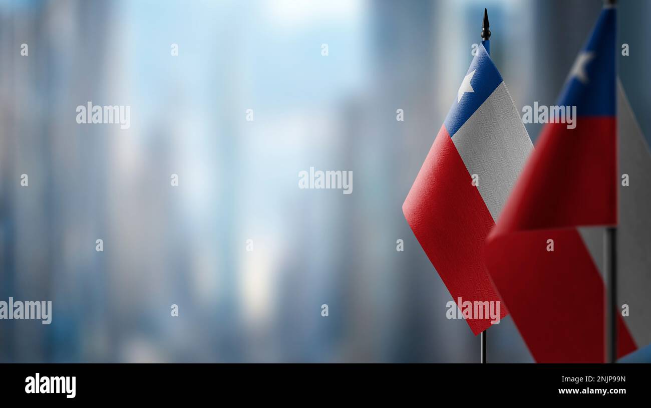 Small flags of the Chile on an abstract blurry background Stock Photo ...