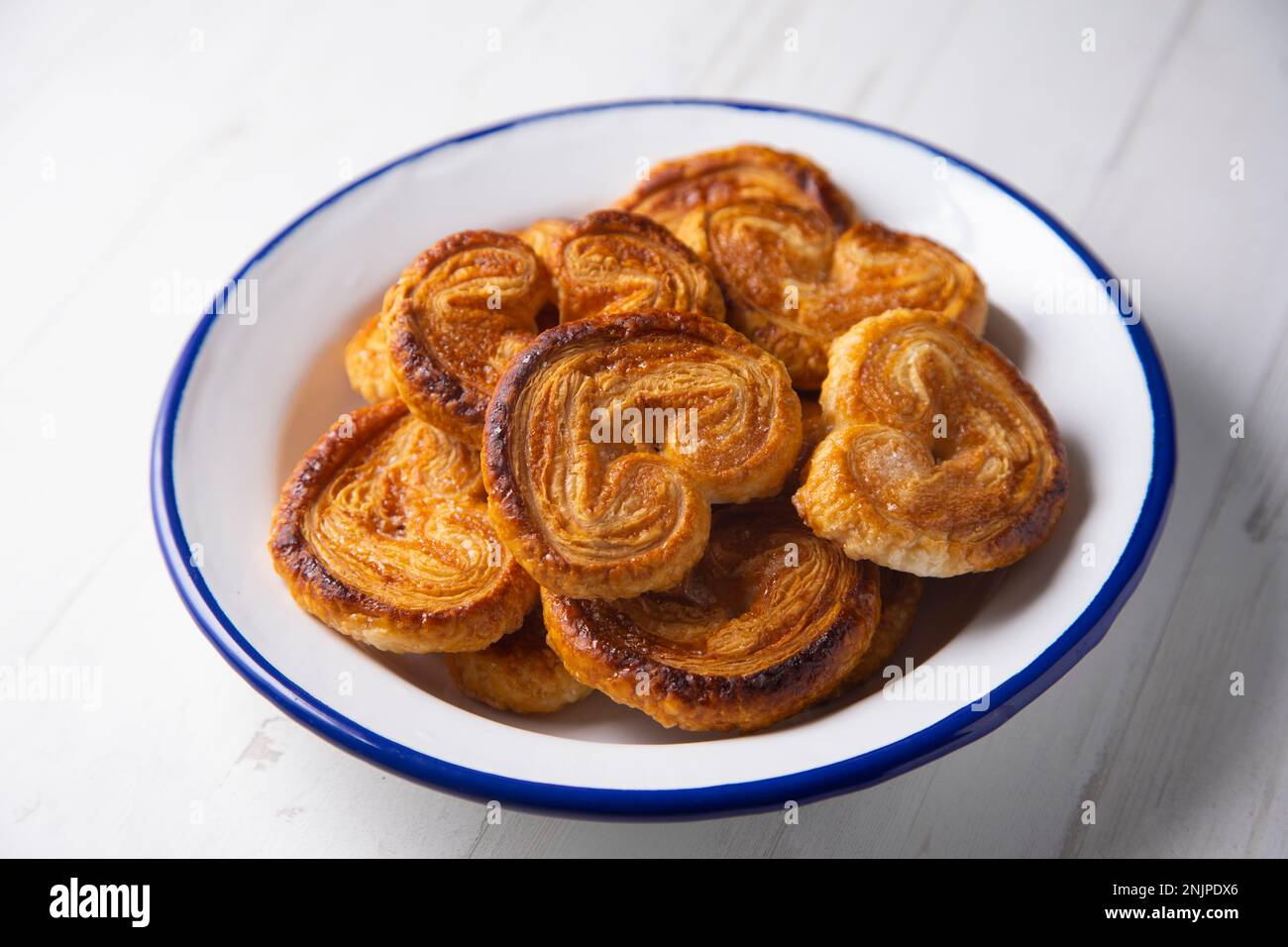 The palmera, palmerita, oreja, orejita, palmita or puff pastry heart is ...