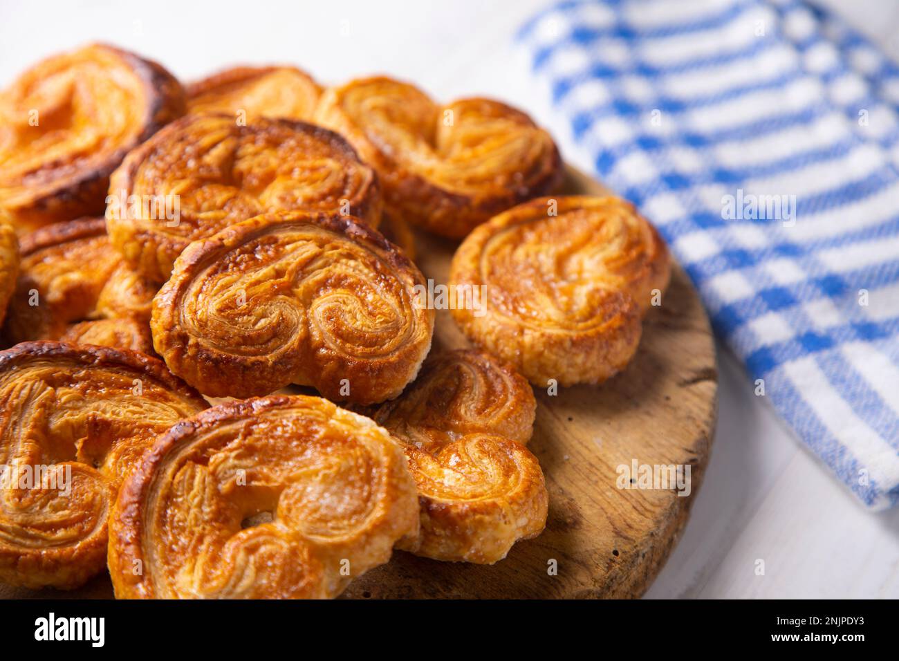 The palmera, palmerita, oreja, orejita, palmita or puff pastry heart is ...