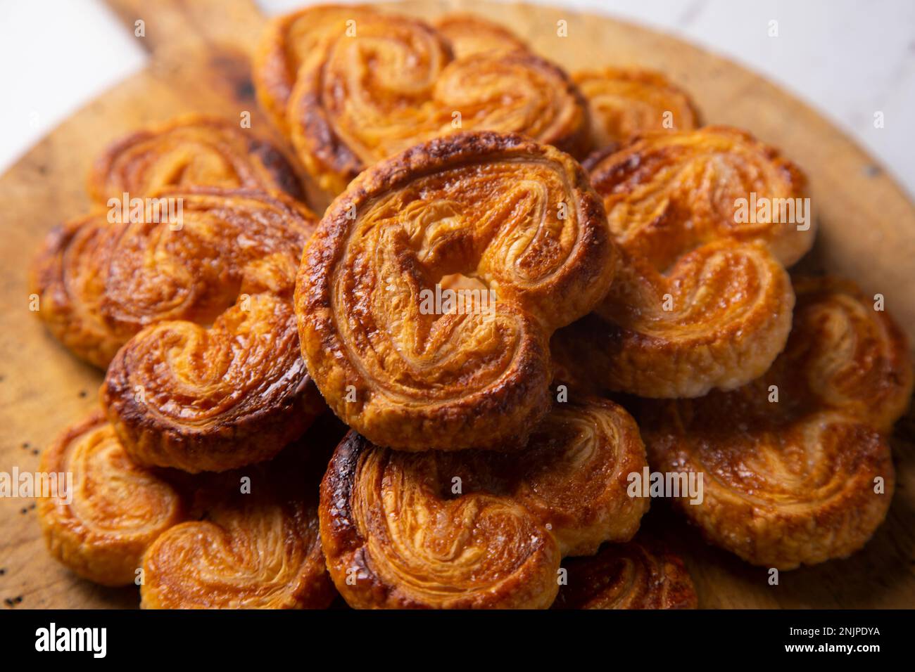 The palmera, palmerita, oreja, orejita, palmita or puff pastry heart is ...
