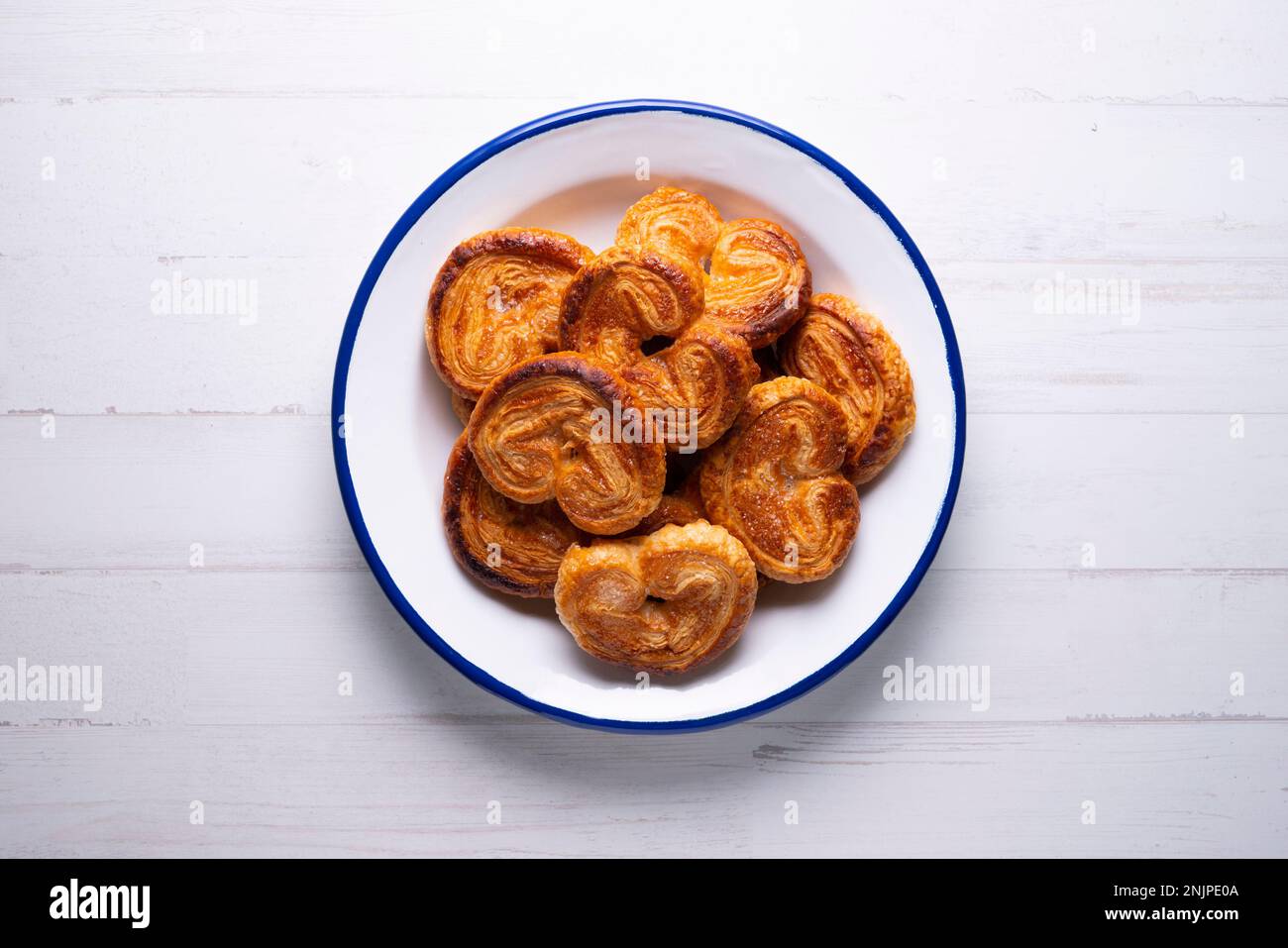 The palmera, palmerita, oreja, orejita, palmita or puff pastry heart is ...