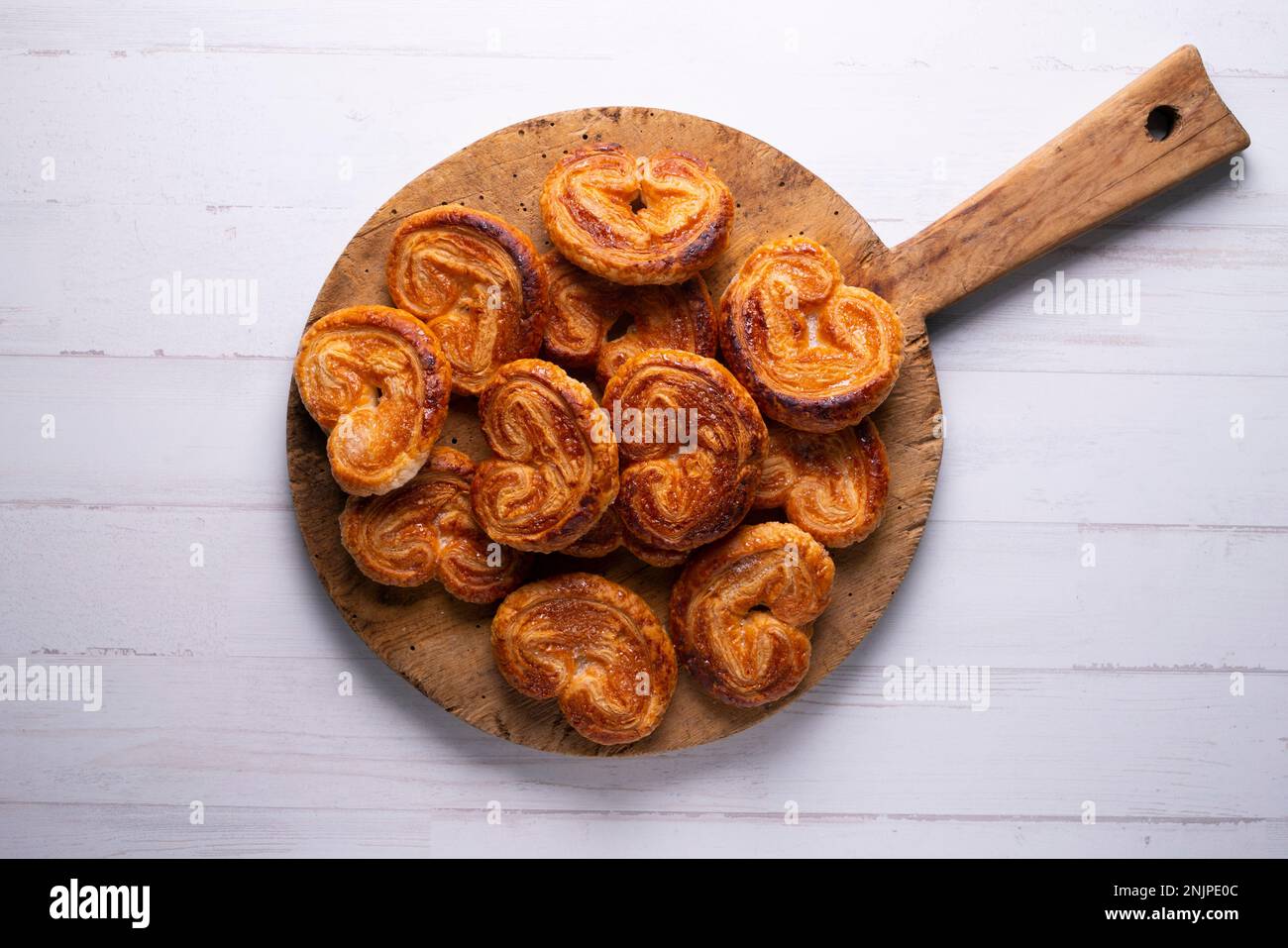 The palmera, palmerita, oreja, orejita, palmita or puff pastry heart is ...