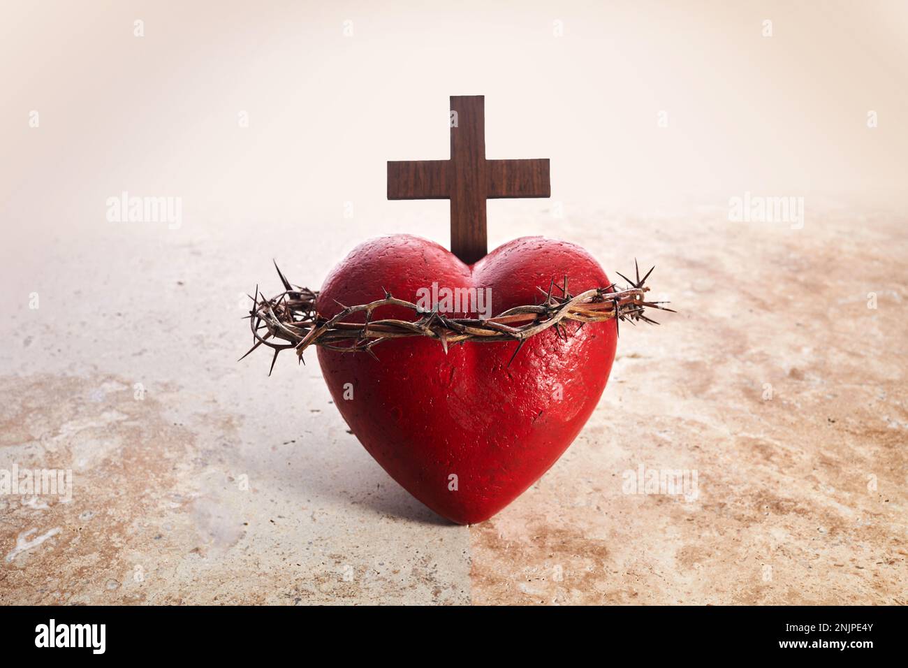 Sacred Heart of Jesus, surrounded by a crown of thorns and with wooden ...
