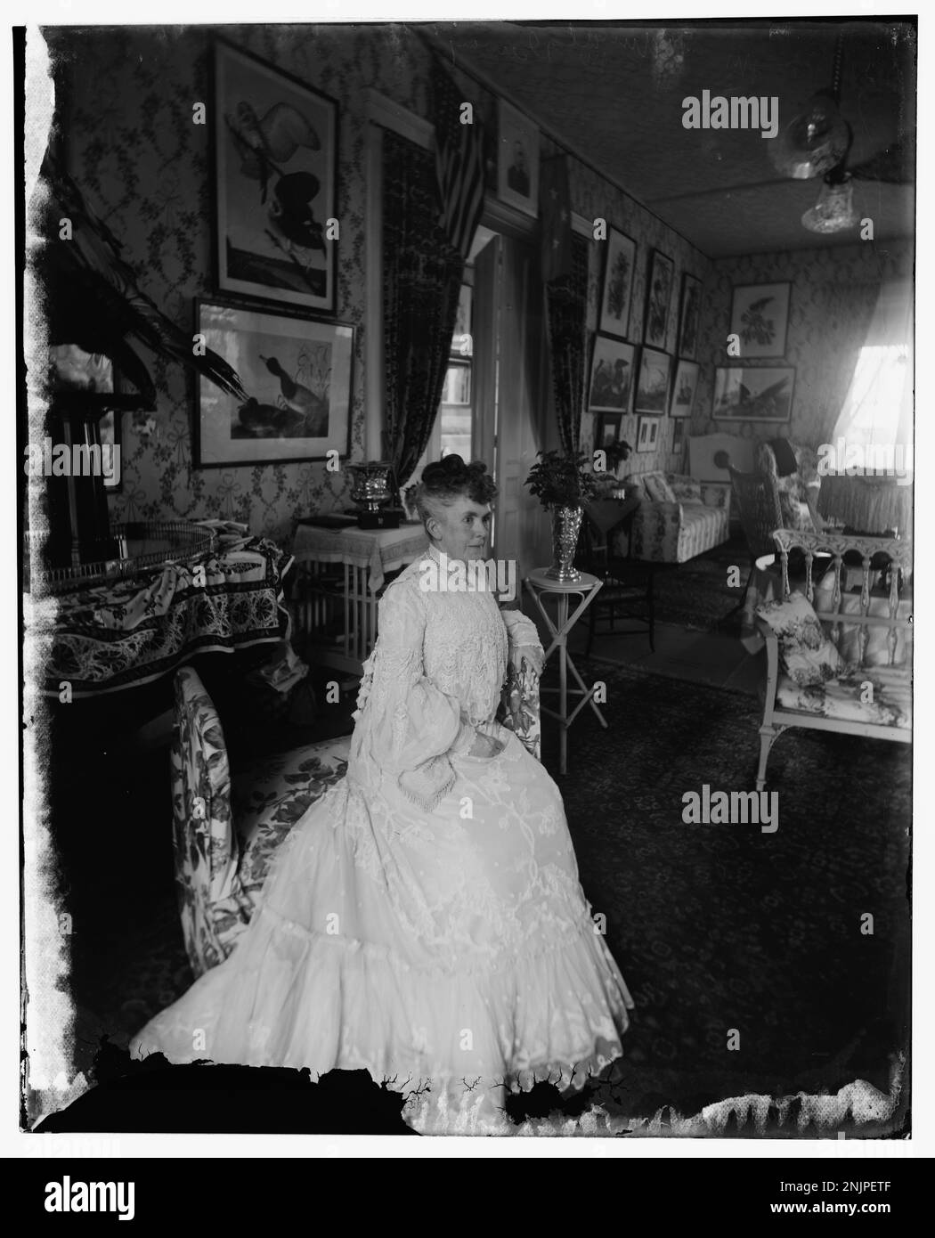 Photograph of Mrs. Dewey, wife of Admiral George Dewey, seated in their ...
