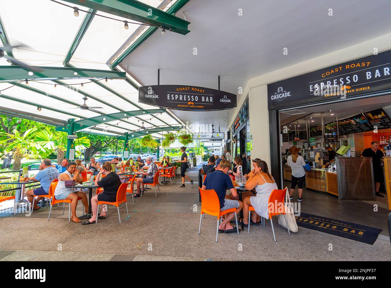 People having a coffee al fresco at the Coast Roast coffee shop on the ...