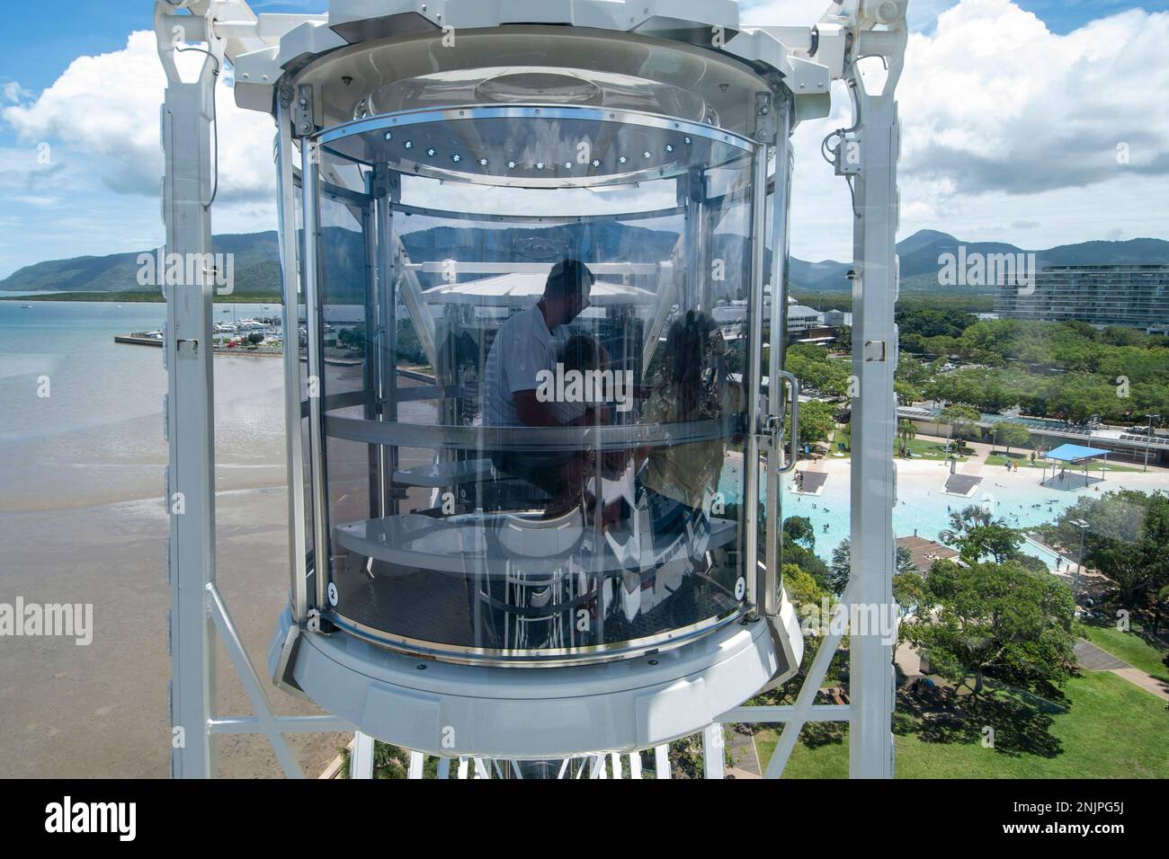 Family on a day out in a pod of the Reef Eye Ferris Wheel, Cairns ...