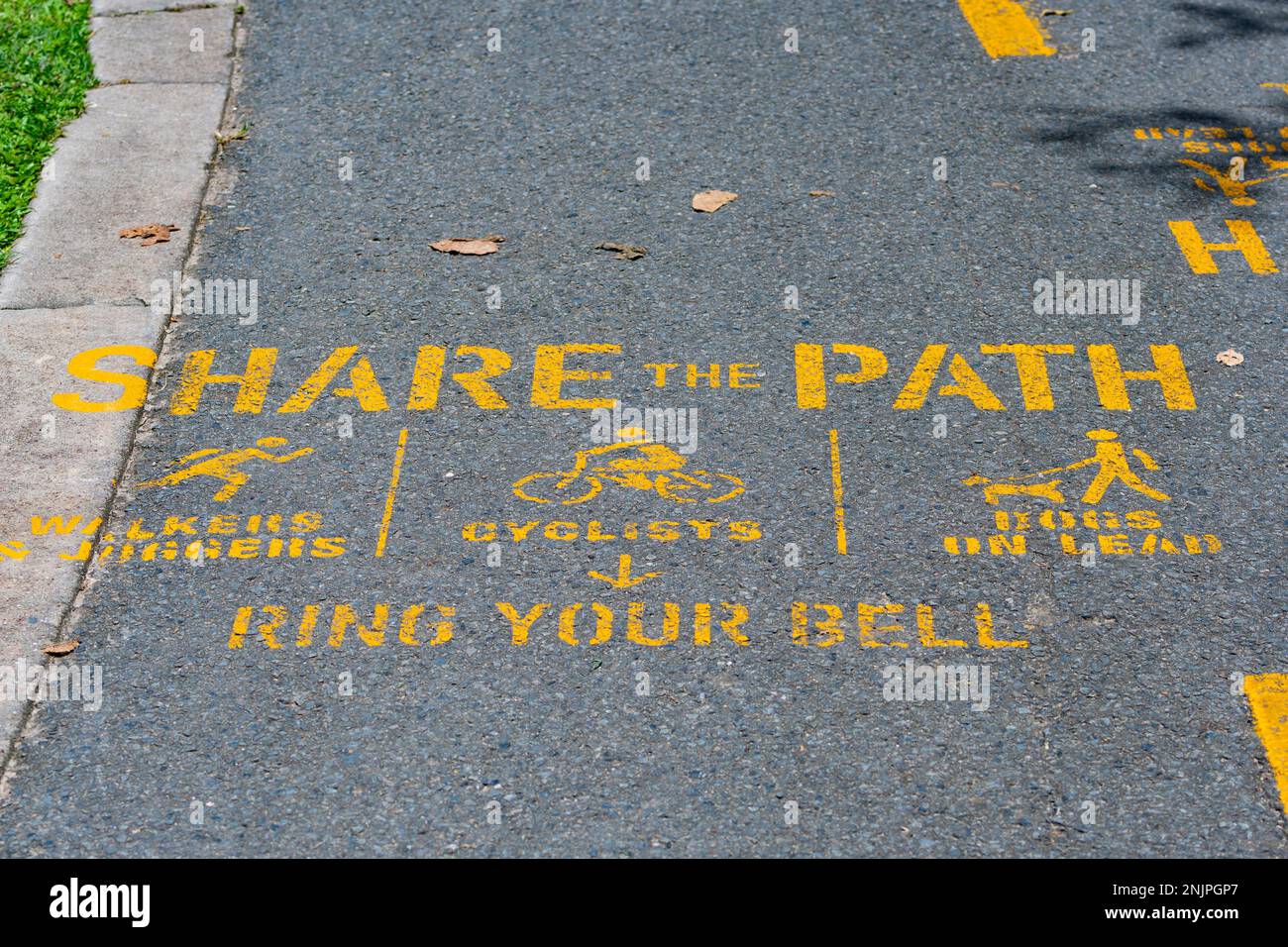 Share the Path sign on a cycling and pedestrians lane, Cairns Esplanade ...