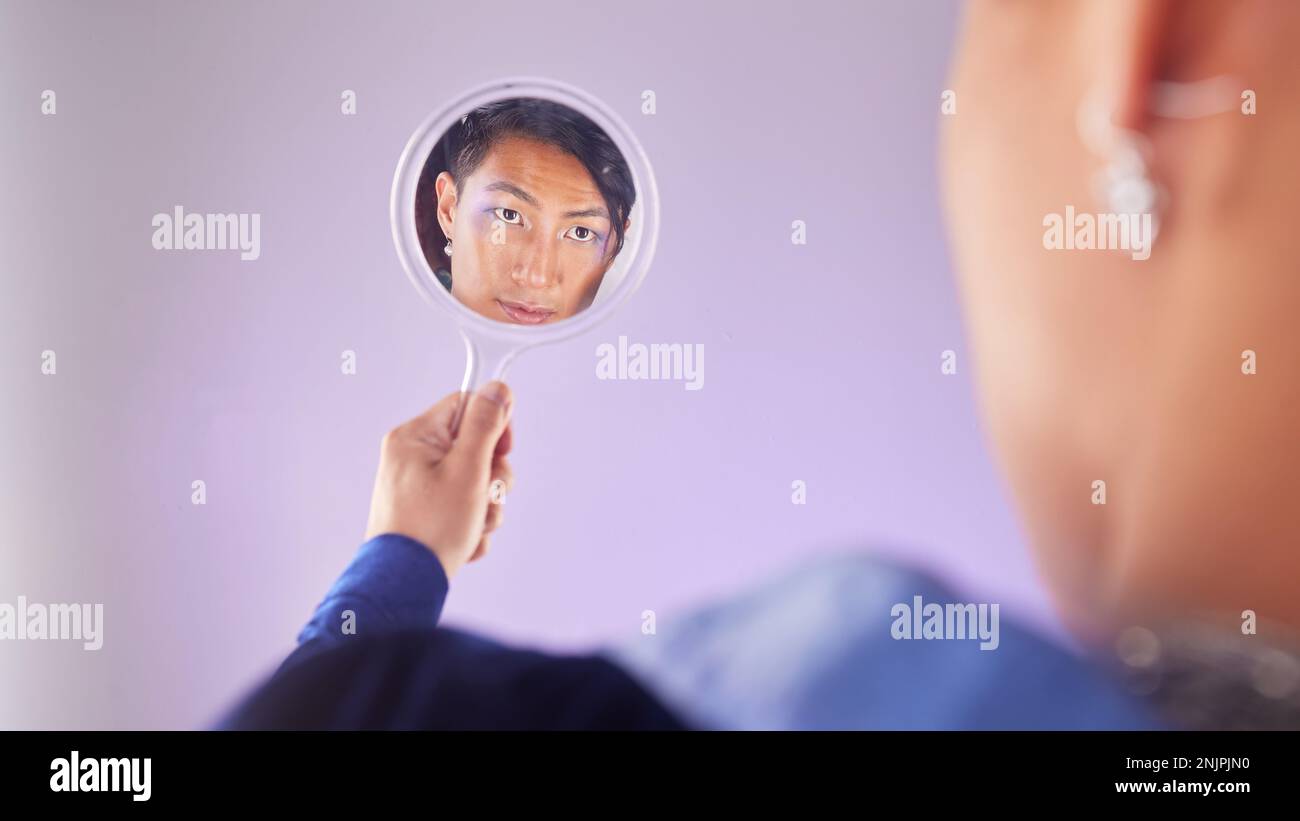 Makeup, reflection and gay man with mirror in hand with pride on purple ...