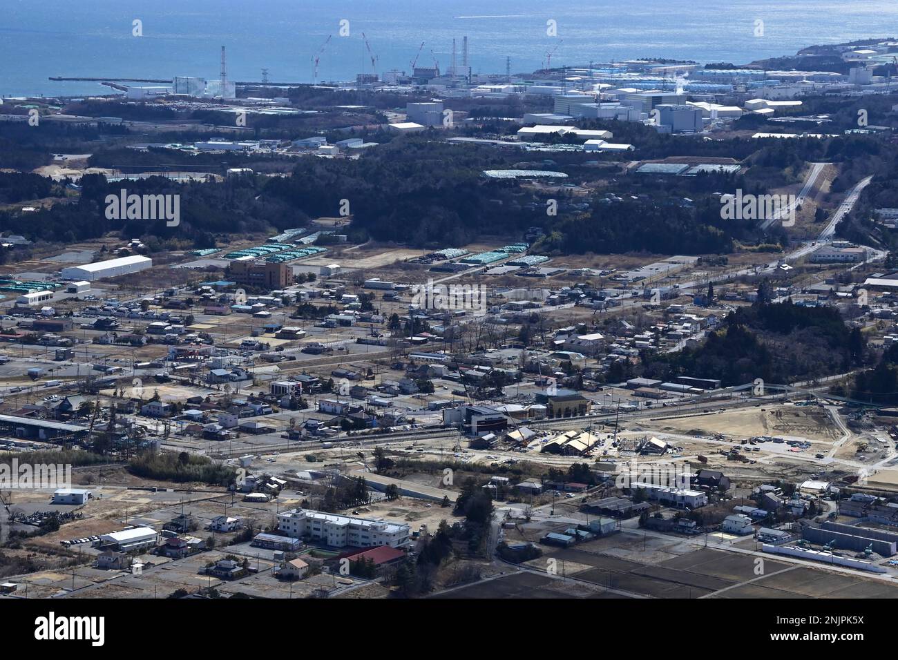 An aerial photo shows JR Futaba Station and surroundings in Futaba Town ...