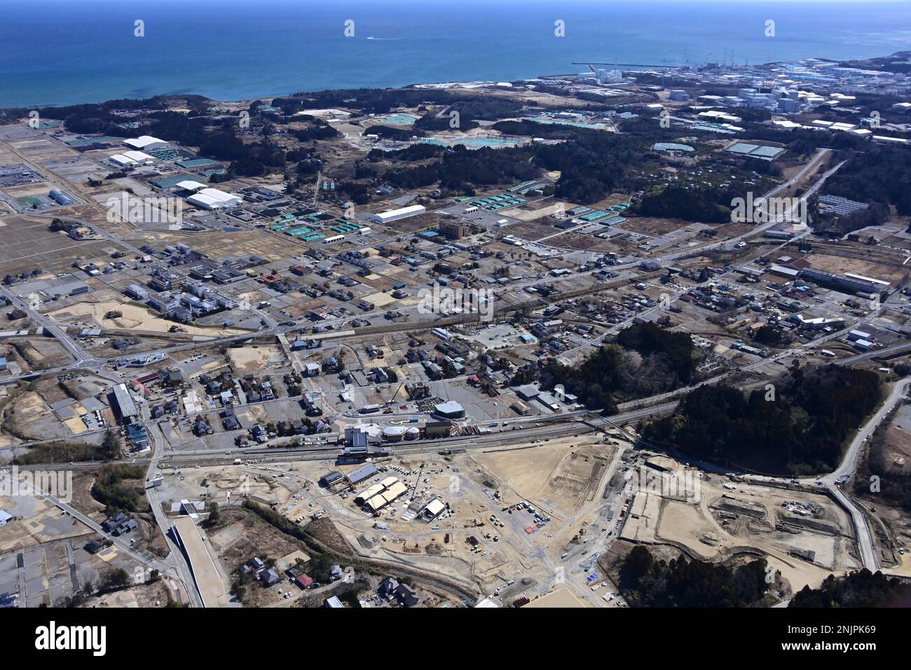 An aerial photo shows JR Futaba Station and surroundings in Futaba Town ...