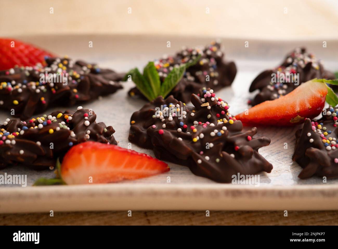 Chocolate rocks with toasted almonds. Traditional Spanish dessert Stock ...