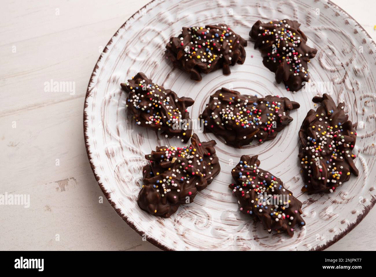 Chocolate rocks with toasted almonds. Traditional Spanish dessert Stock ...