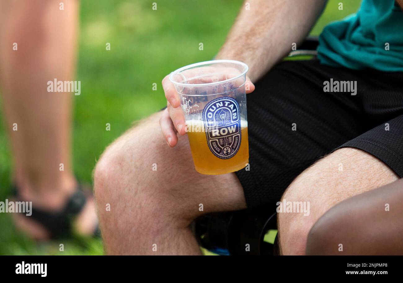 Levi Hanson enjoys a beer in a new Fountain Row plastic cup during the ...