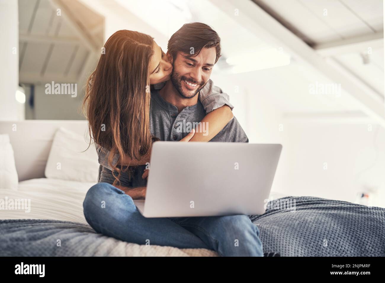 Her surprise kisses are the best. an attractive young couple spending ...