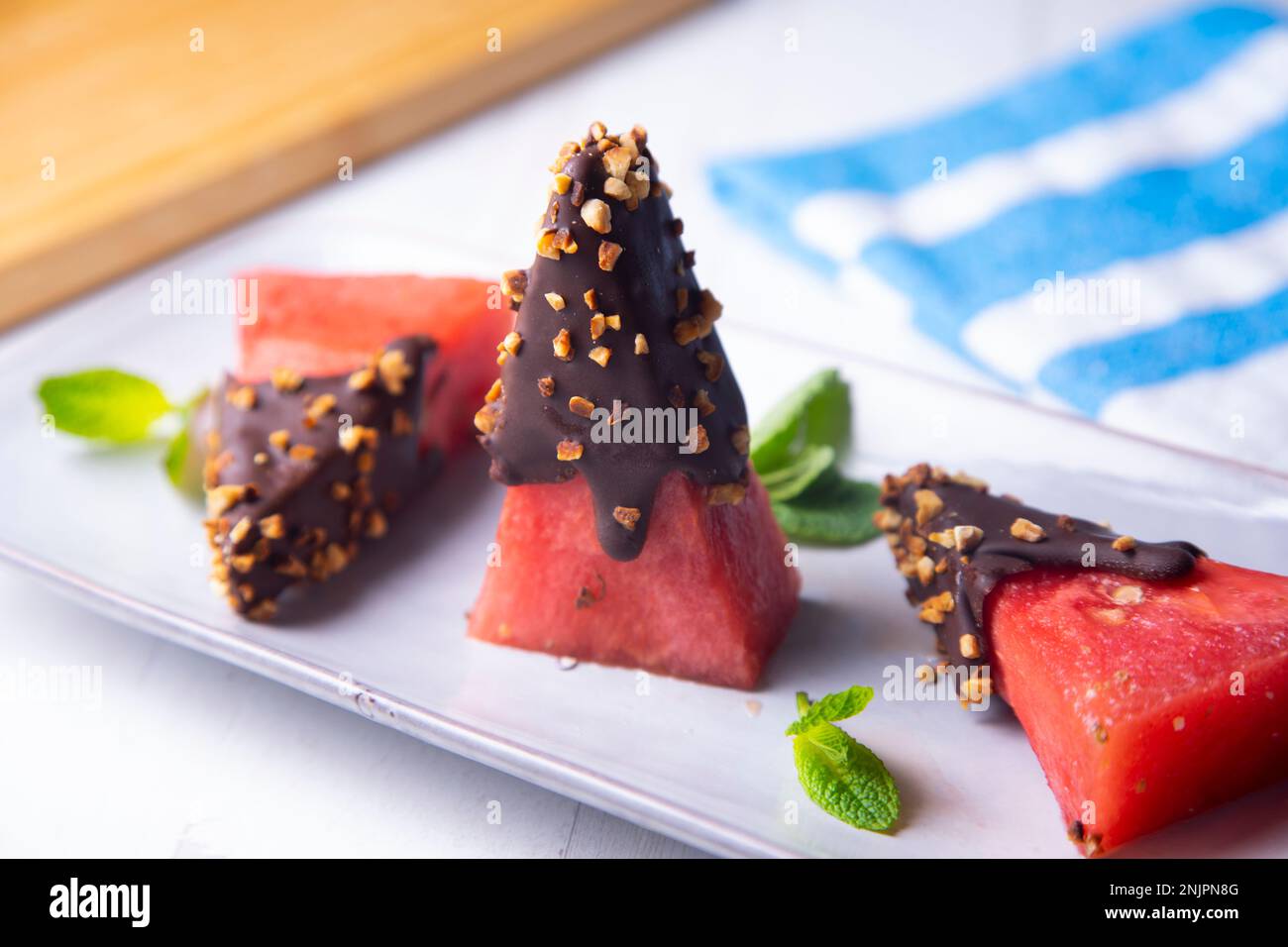 Chunks of fresh watermelon dipped in chocolate and covered with ...
