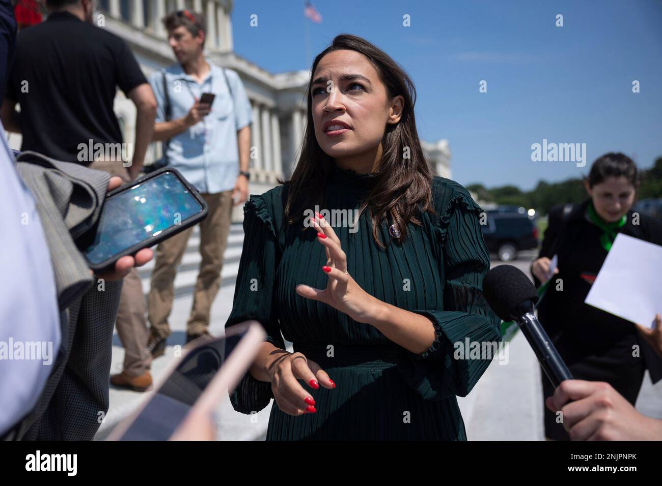Rep. Alexandria Ocasio-Cortez (D-N.Y.) speaks wIth reporters outside ...