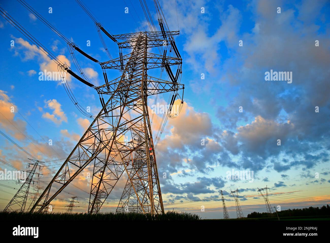 Electric tower, silhouette at sunset Stock Photo - Alamy
