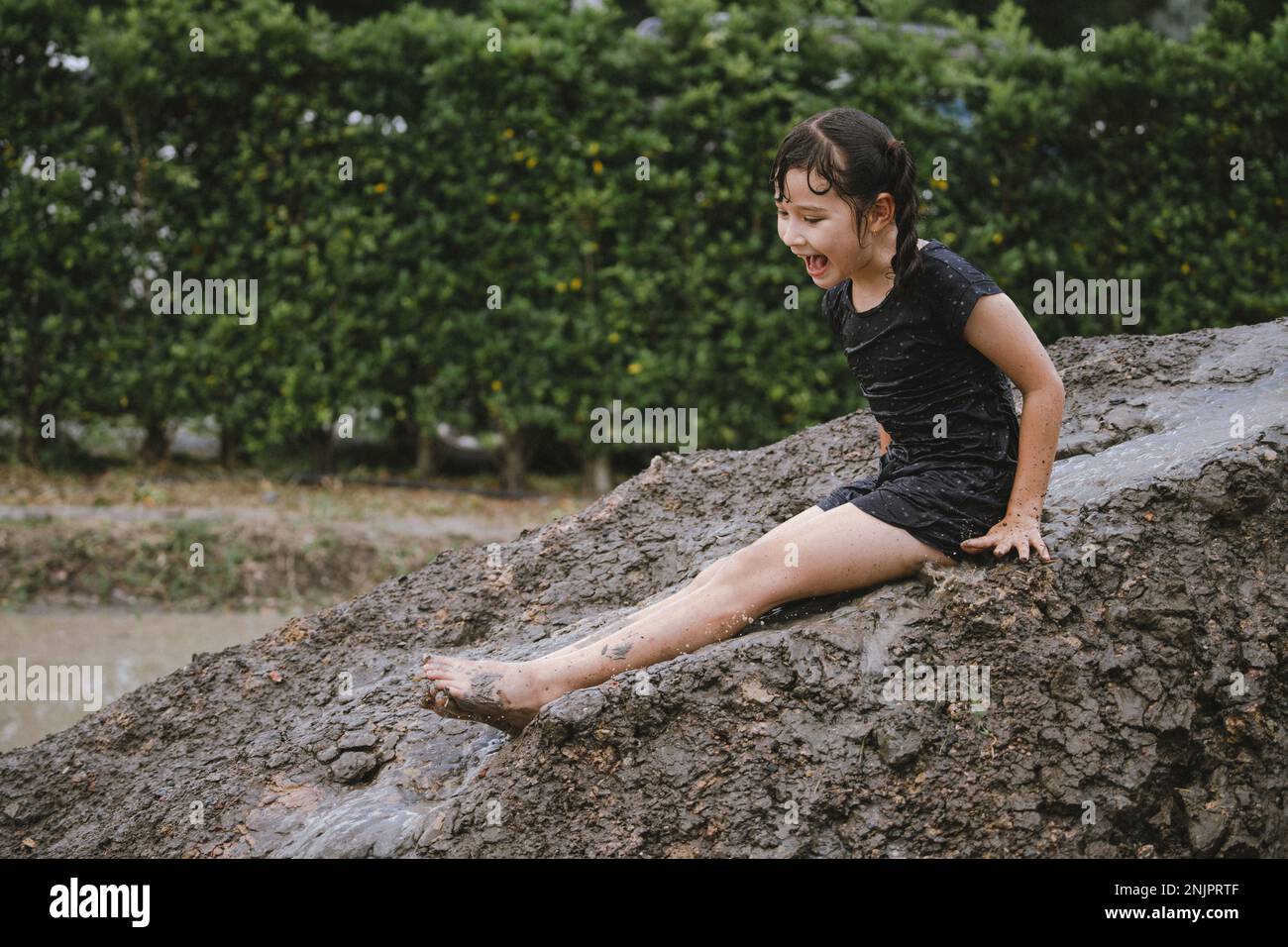 Girl in mud hi-res stock photography and images - Alamy