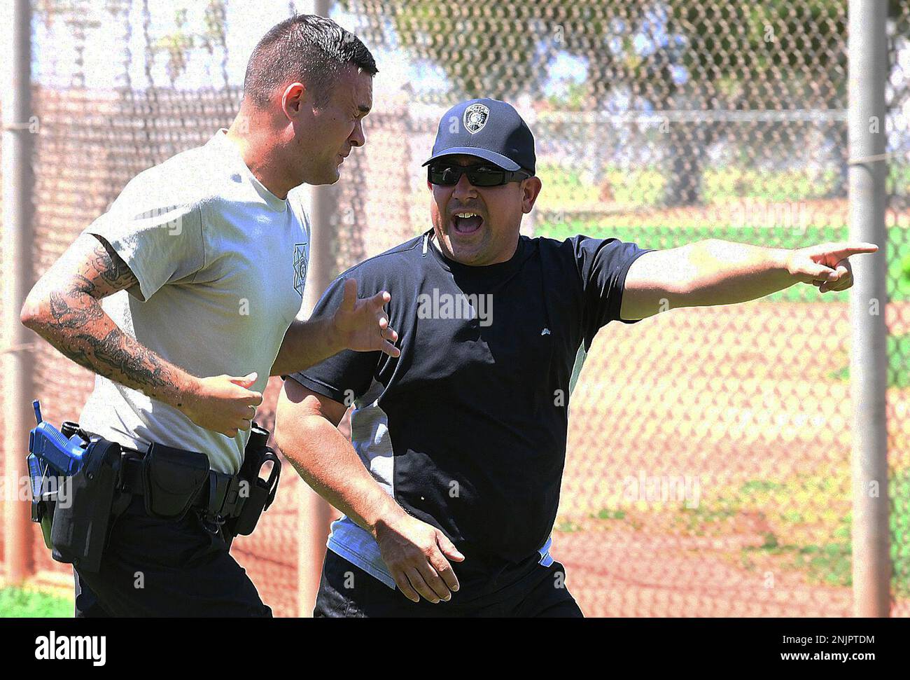 Yuma Police Department Officer Evan Stokes, right, directs Arizona ...