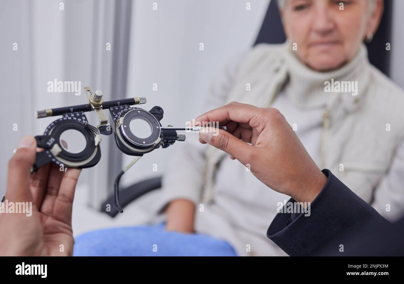 Optometrist hands, test glasses and senior woman for health advice and ...