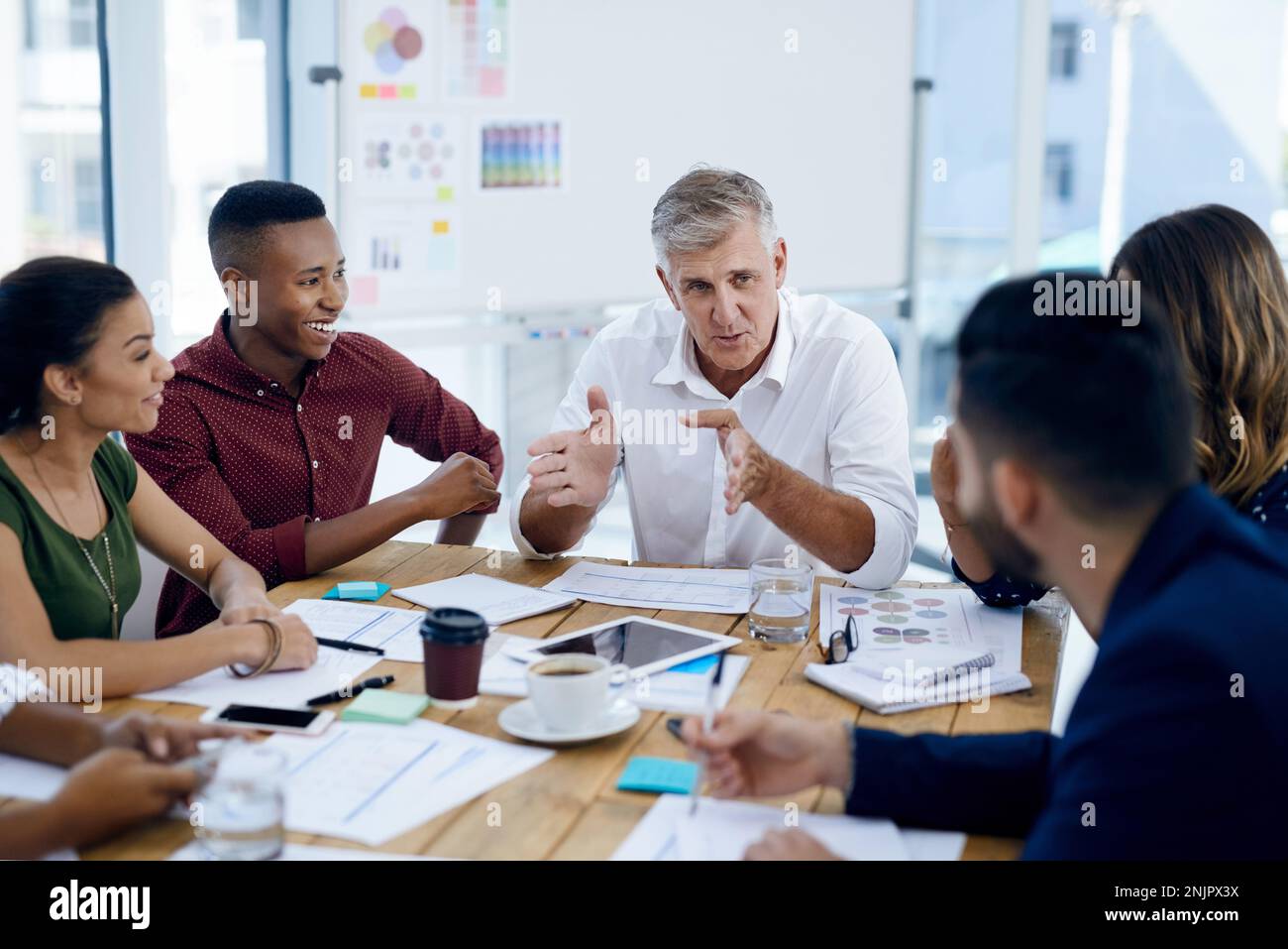 The dream makes the team work. creative employees working in a modern ...