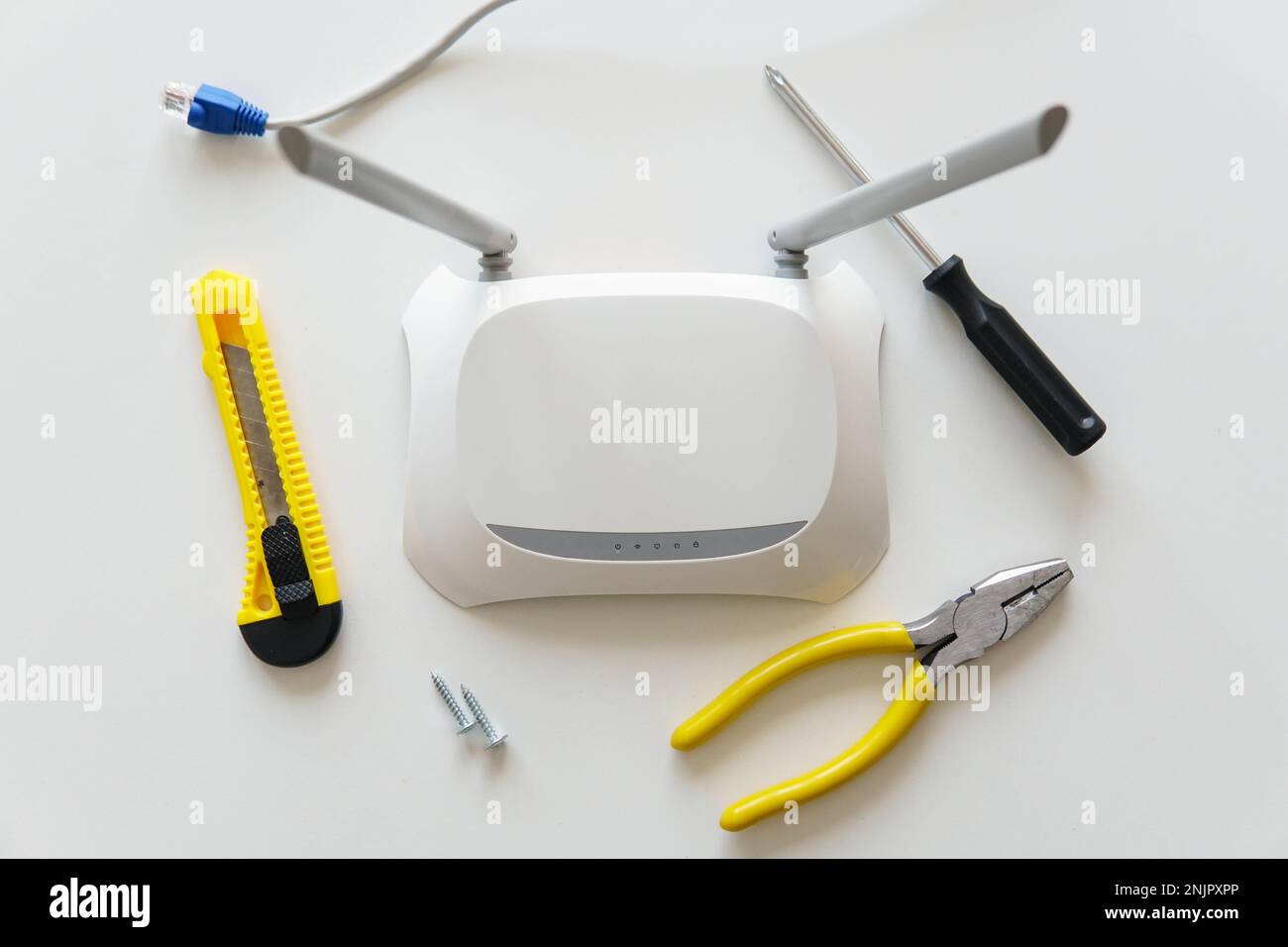 Repairing tools with a wireless wifi router on the table. Top view ...