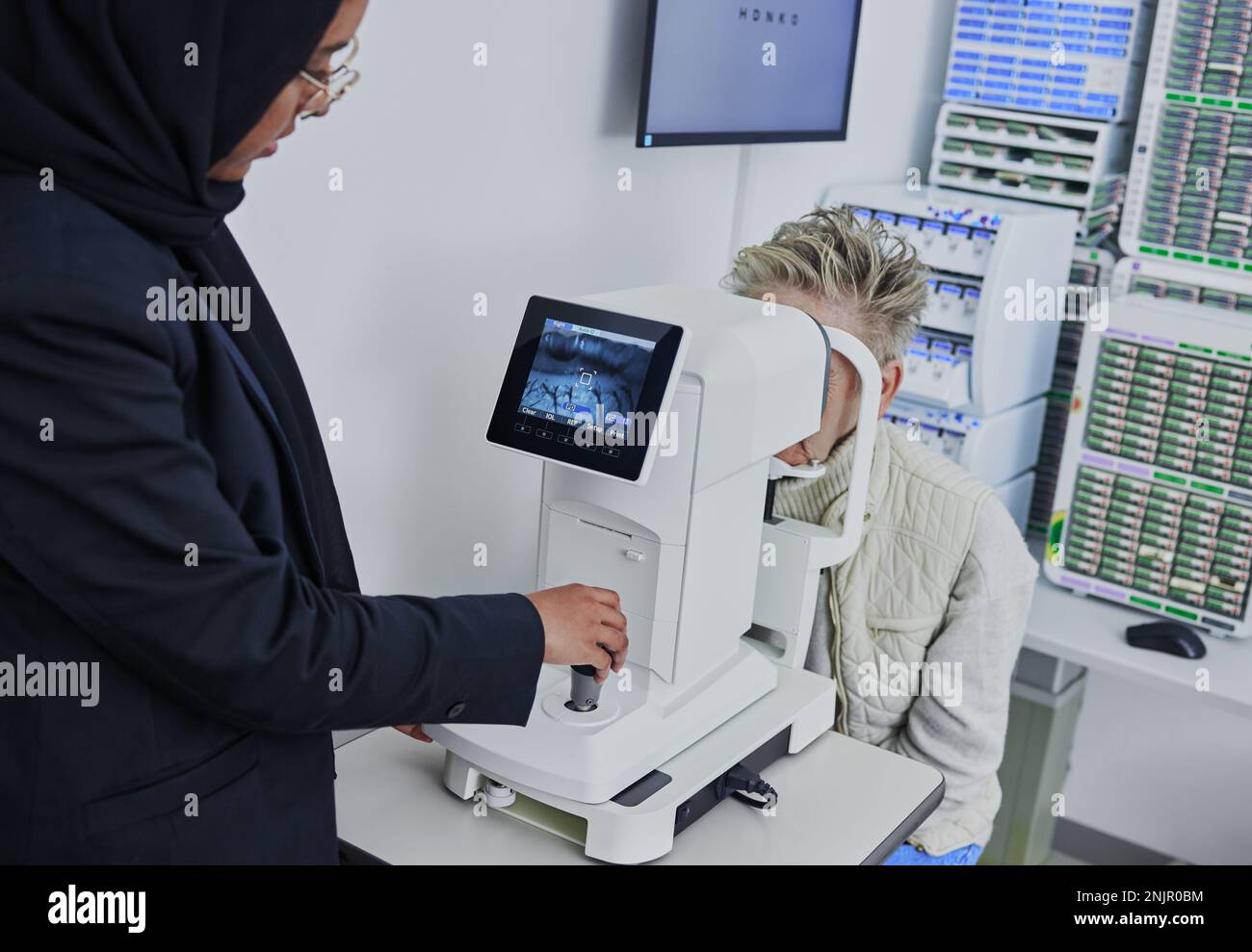 Optometry, screen for eye exam and optician with patient for vision ...