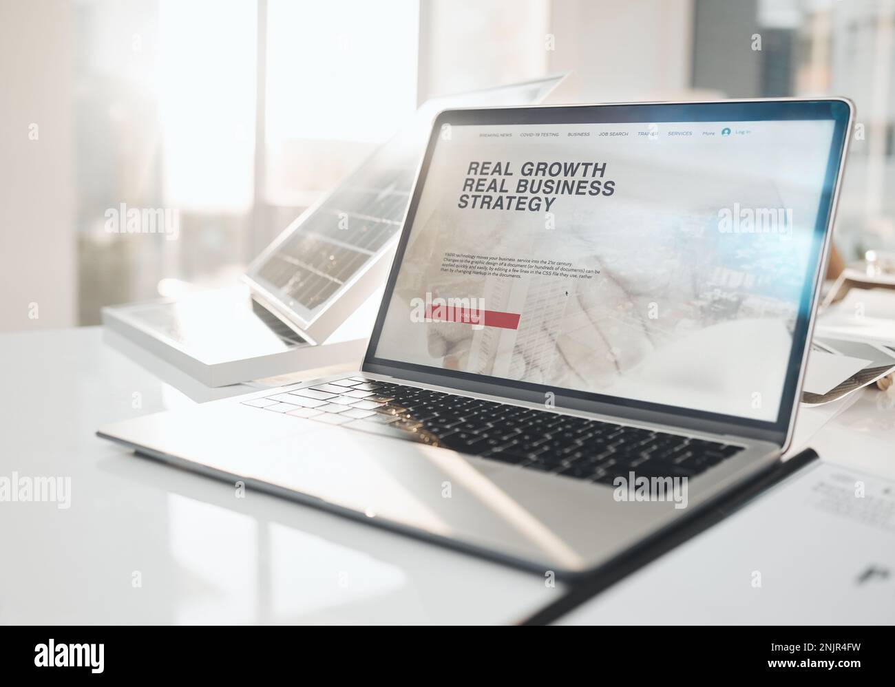 Laptop screen, business strategy and table in office with solar panel ...