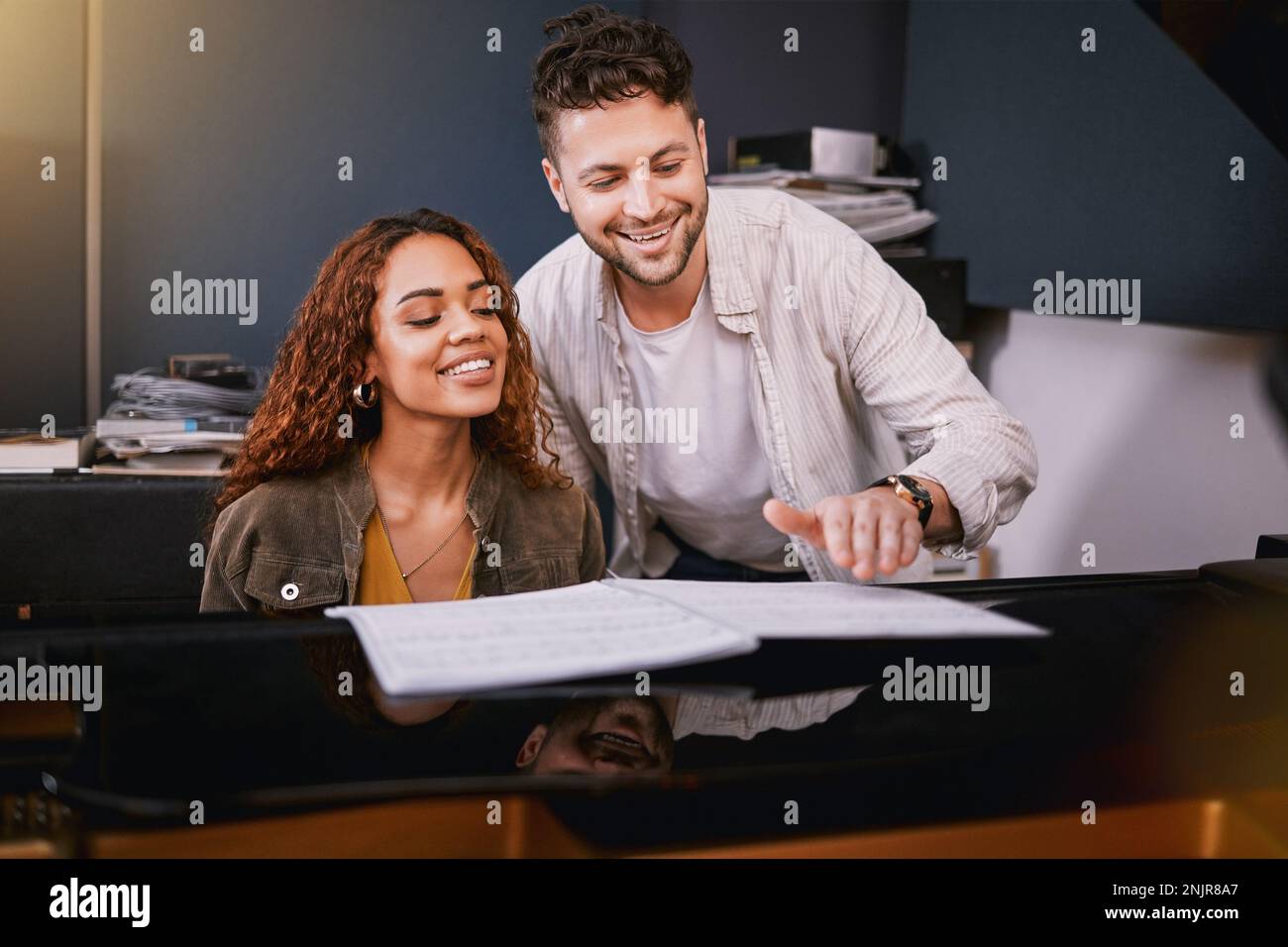 Couple at a piano hi-res stock photography and images - Alamy
