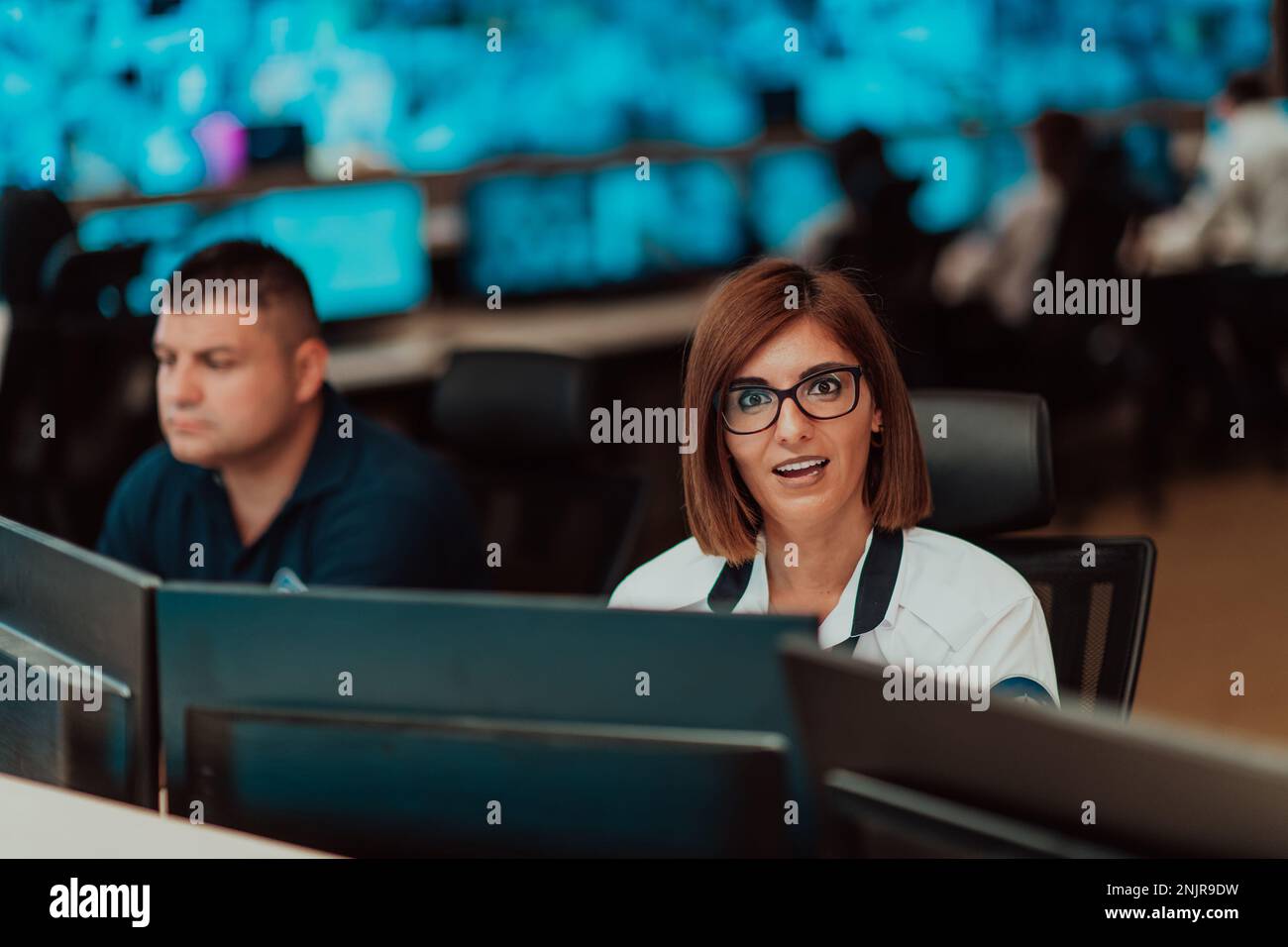Group of Security data center operators working in a CCTV monitoring ...