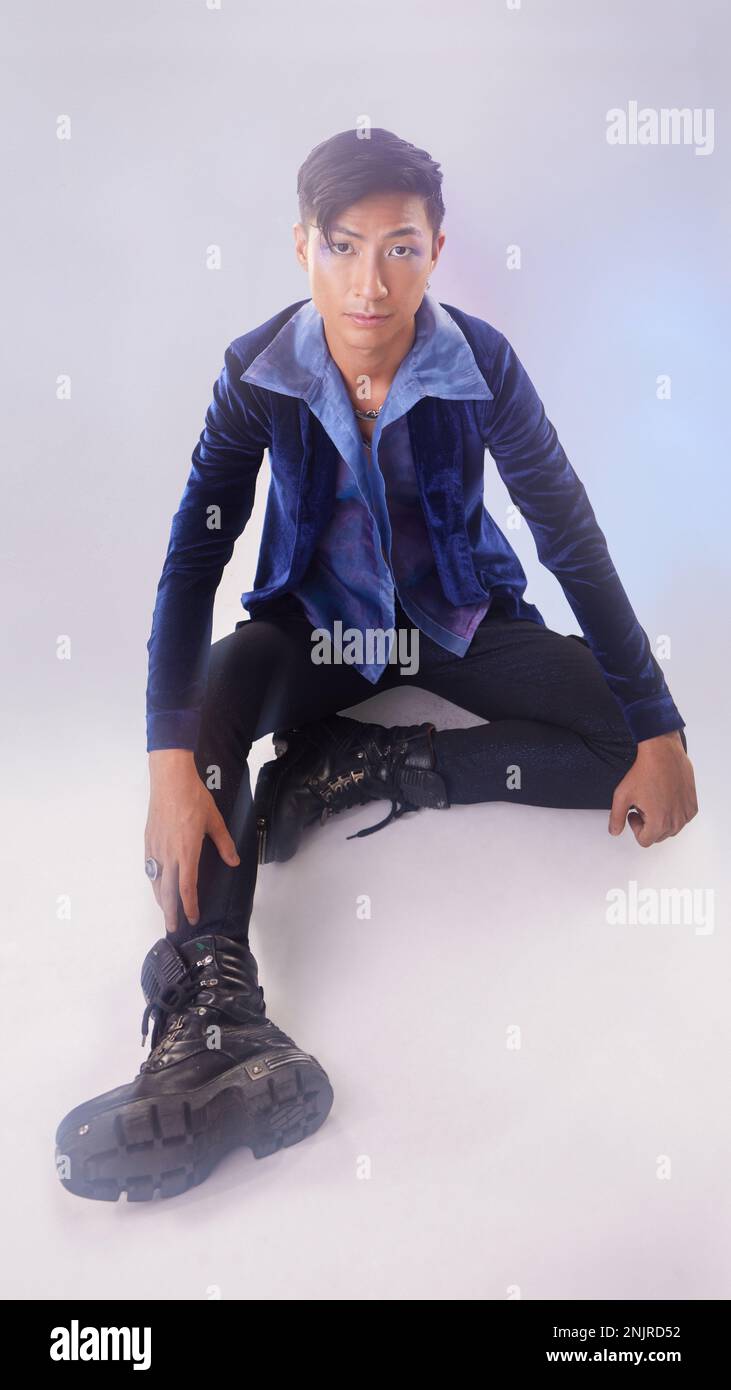 Makeup, portrait of gay man on floor in fashion and pride in Indonesia ...