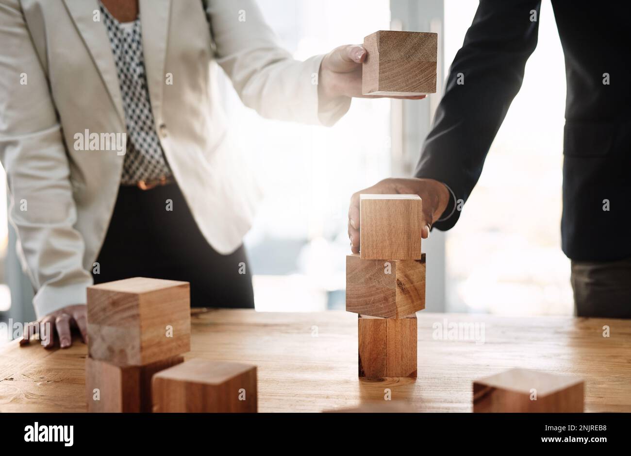 Building on their success together. two unrecognizable businesspeople ...