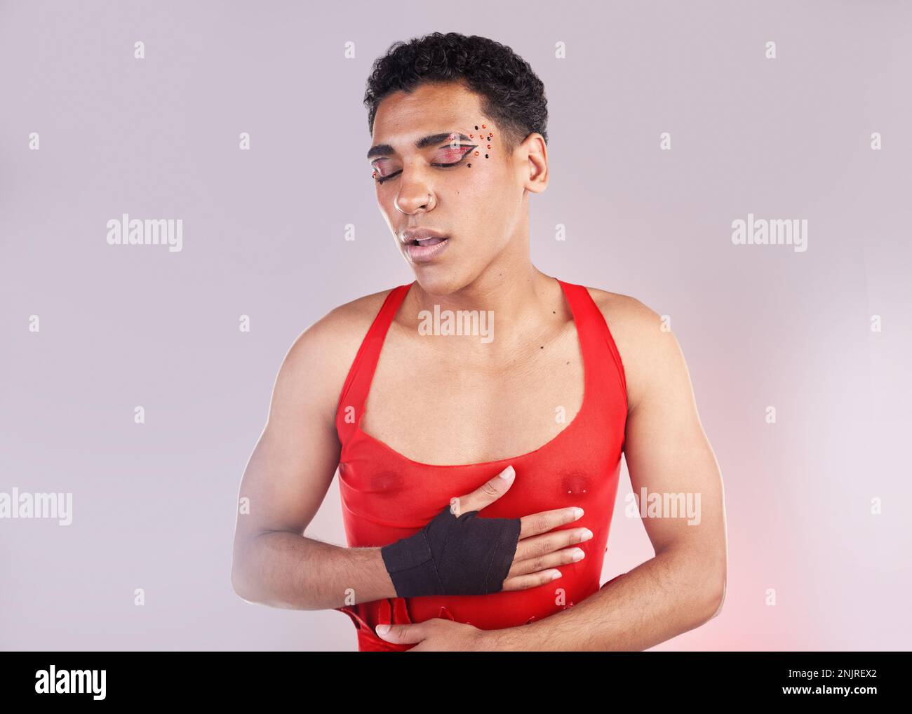 Punk, fashion and makeup man isolated on studio background for creative ...