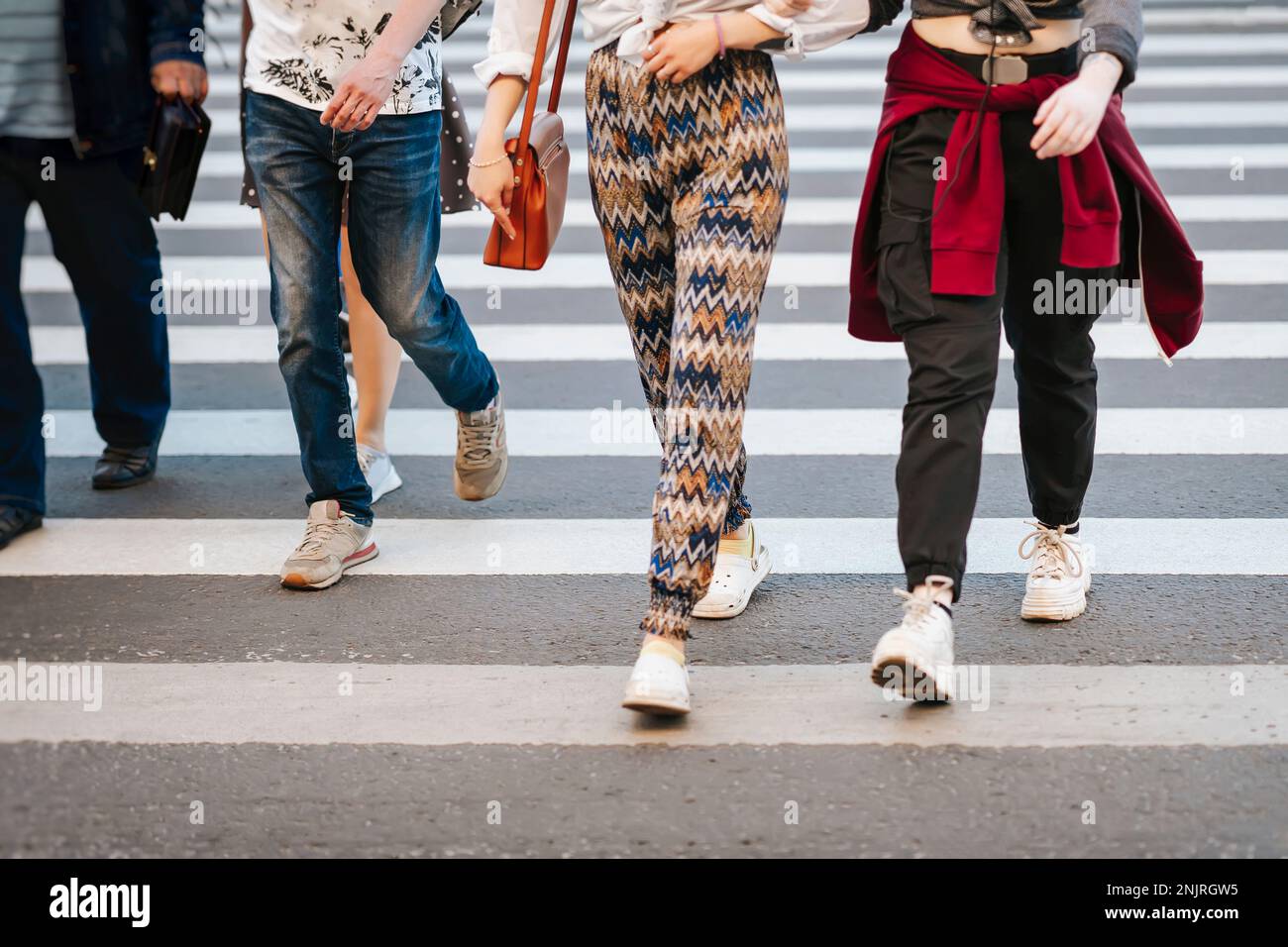 Abstract anonymous people walking on zebra crossing city street in ...