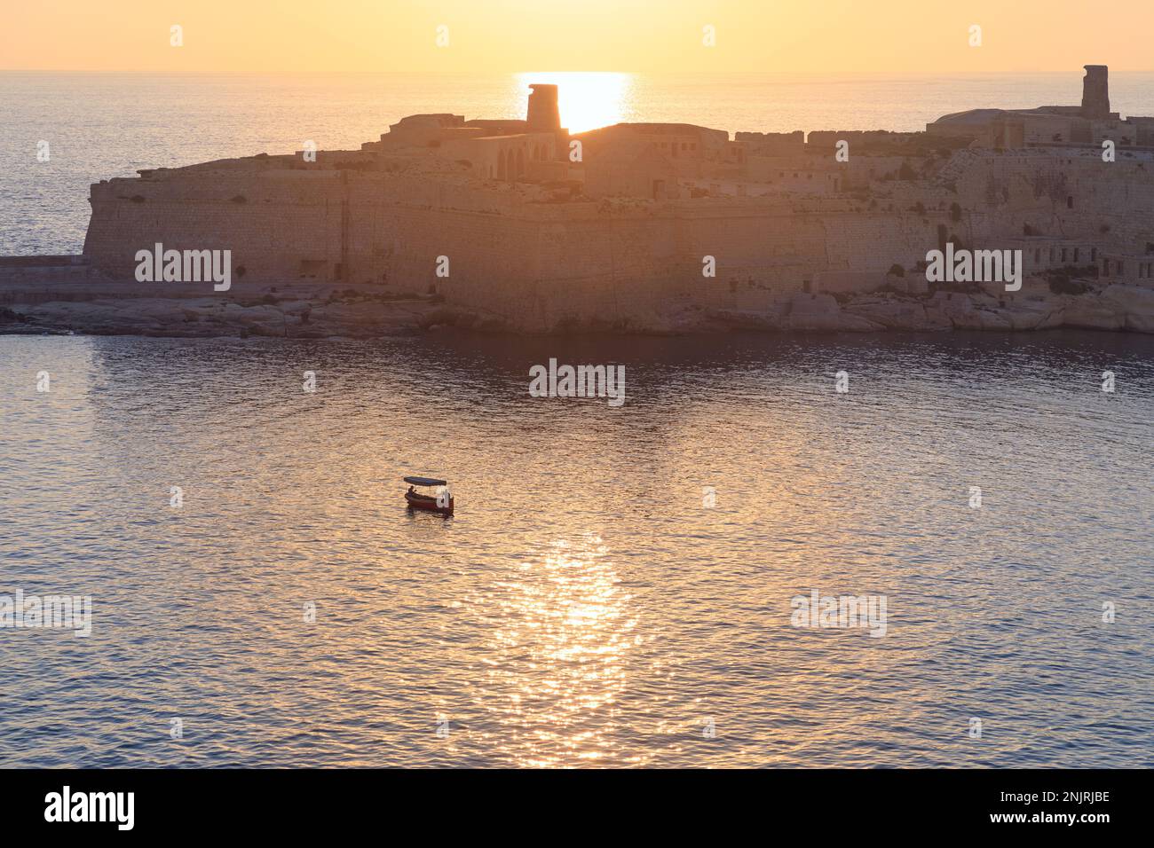 Sunrise view of Grand Harbour in Malta. View of Fort Ricasoli ...