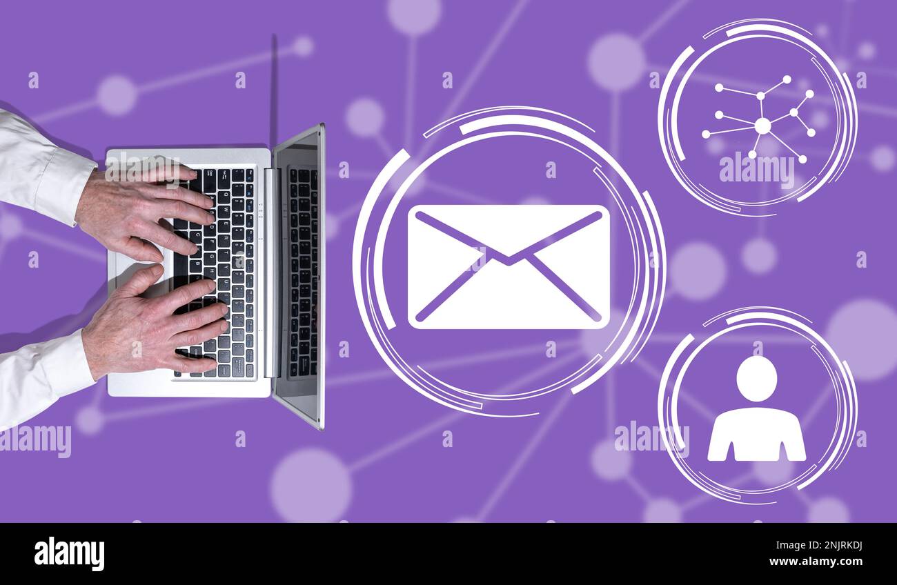Top view of hands using laptop with symbol of email sending concept ...