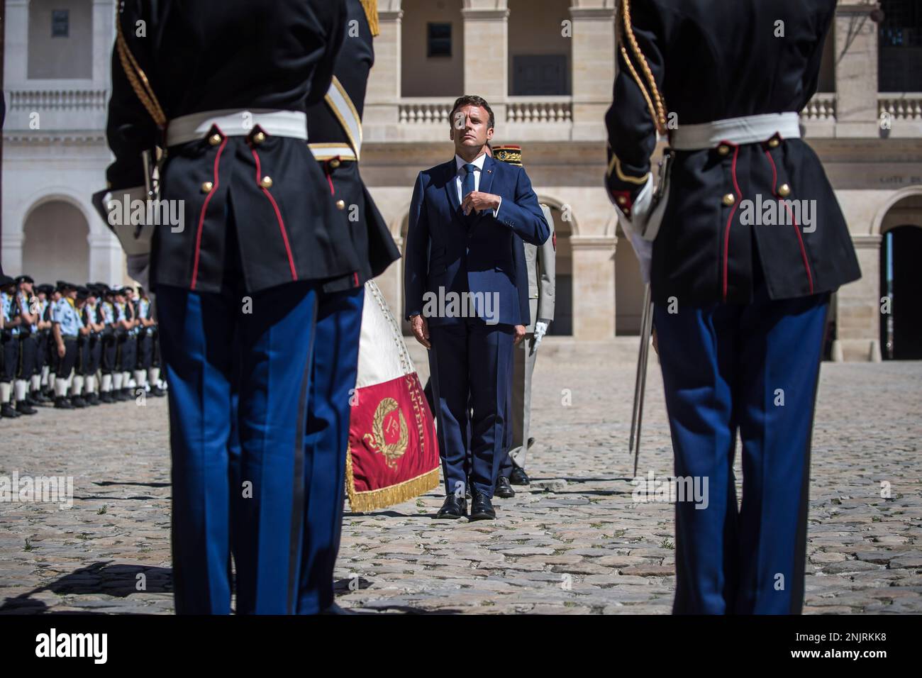 French President Emmanuel Macron stands by honor guards presenting the ...