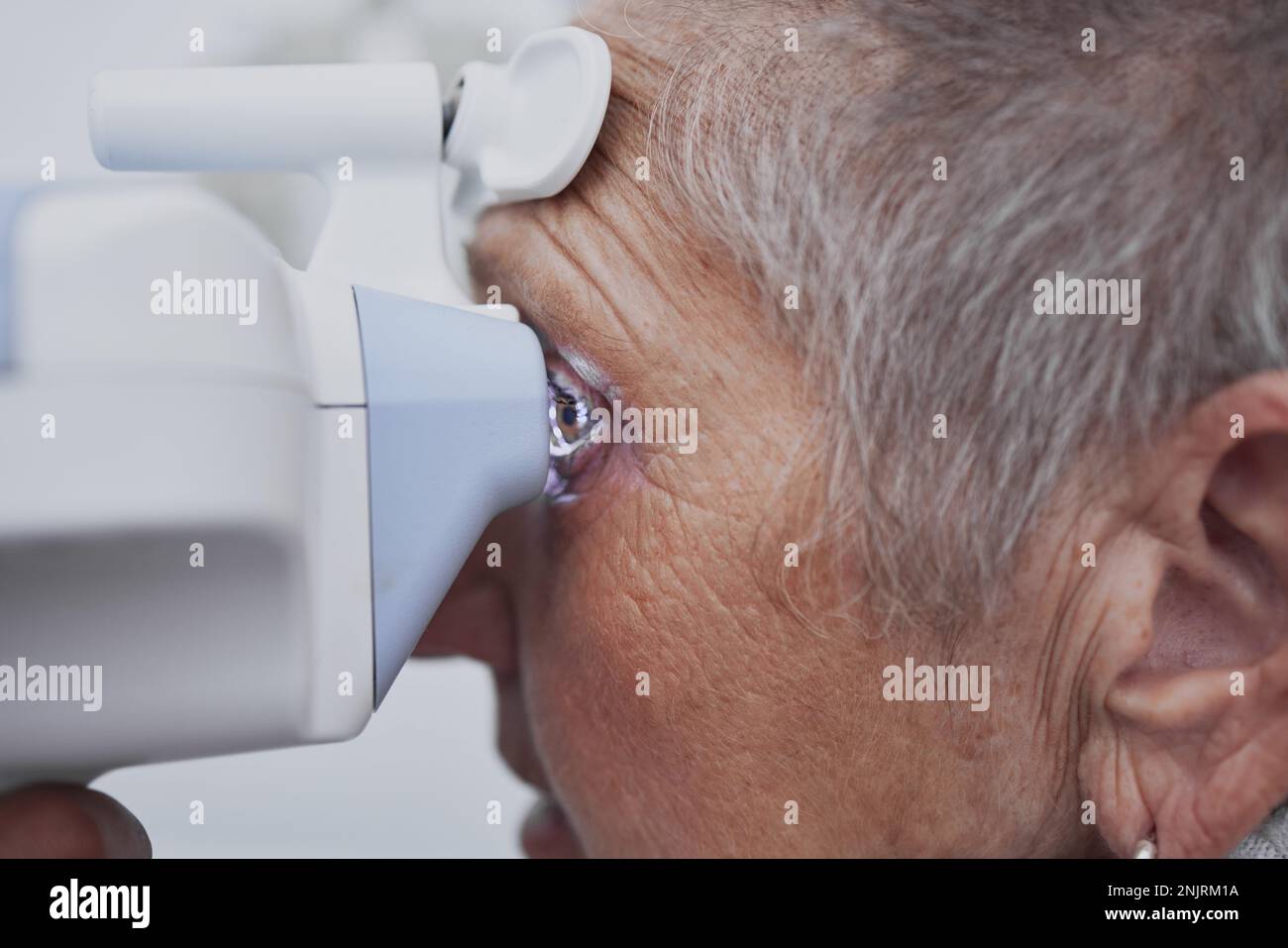 Optometry, eye exam and medical with old woman and consulting for ...