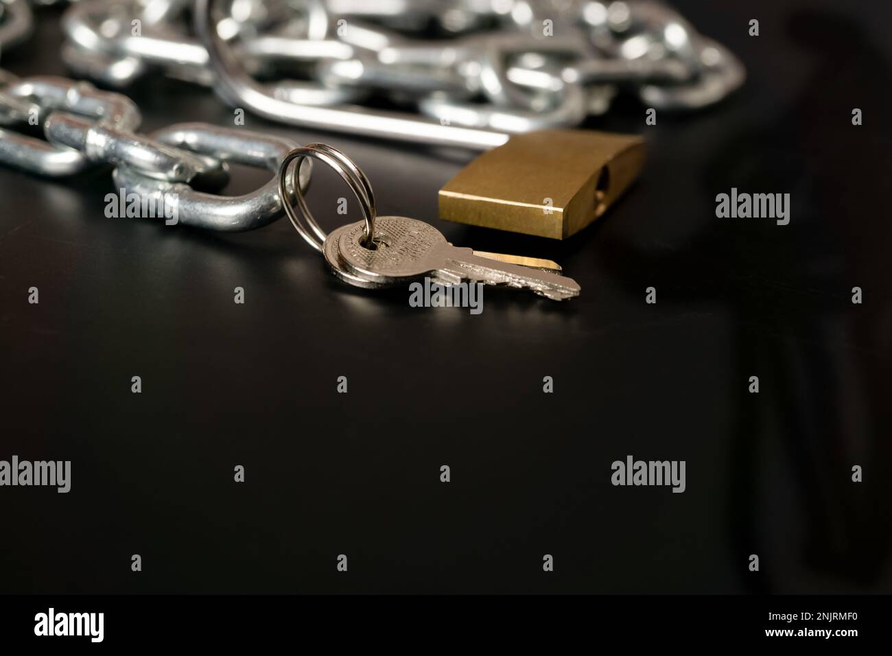 padlock with key and chains in the background isolated on a white ...