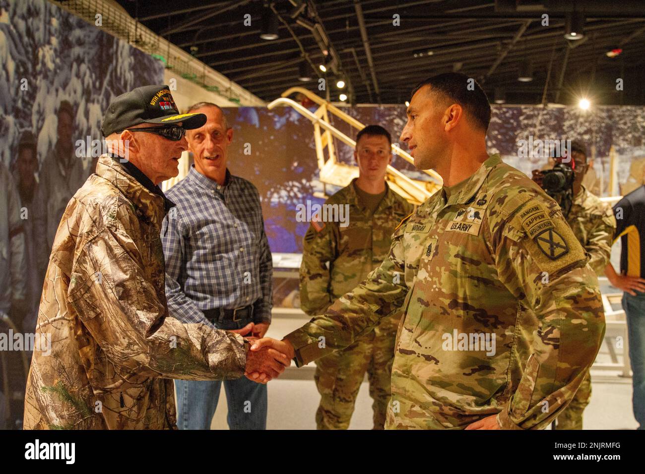 Mr. Hilton Labow, a 98 year-old WWII Veteran shakes hands with Command ...