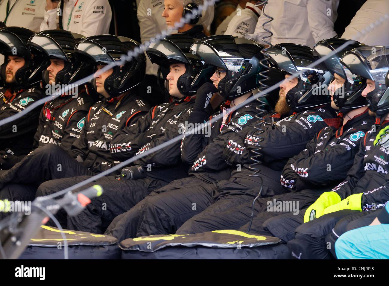 Mercedes' mechanics sit in the pit during the Austrian F1 Grand Prix at ...