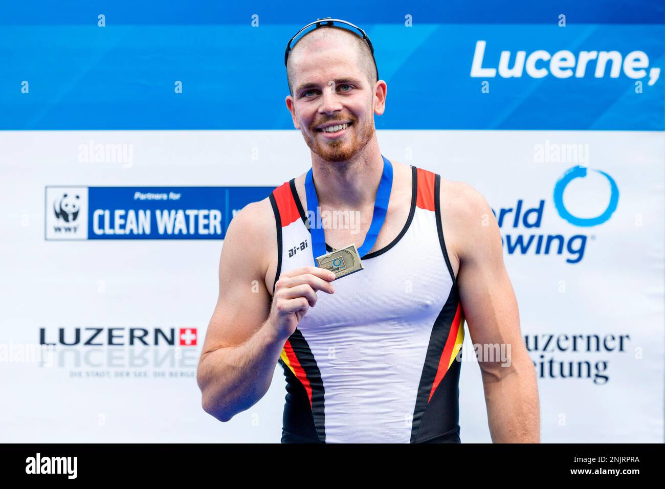 Germany's Marc Weber poses with is bronze medal for the Men's Single Sculls Final A, on the ...