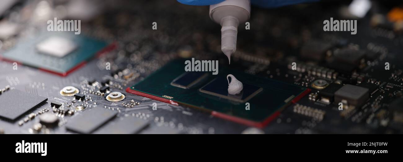 Thermal paste on computer processor chip closeup Stock Photo - Alamy