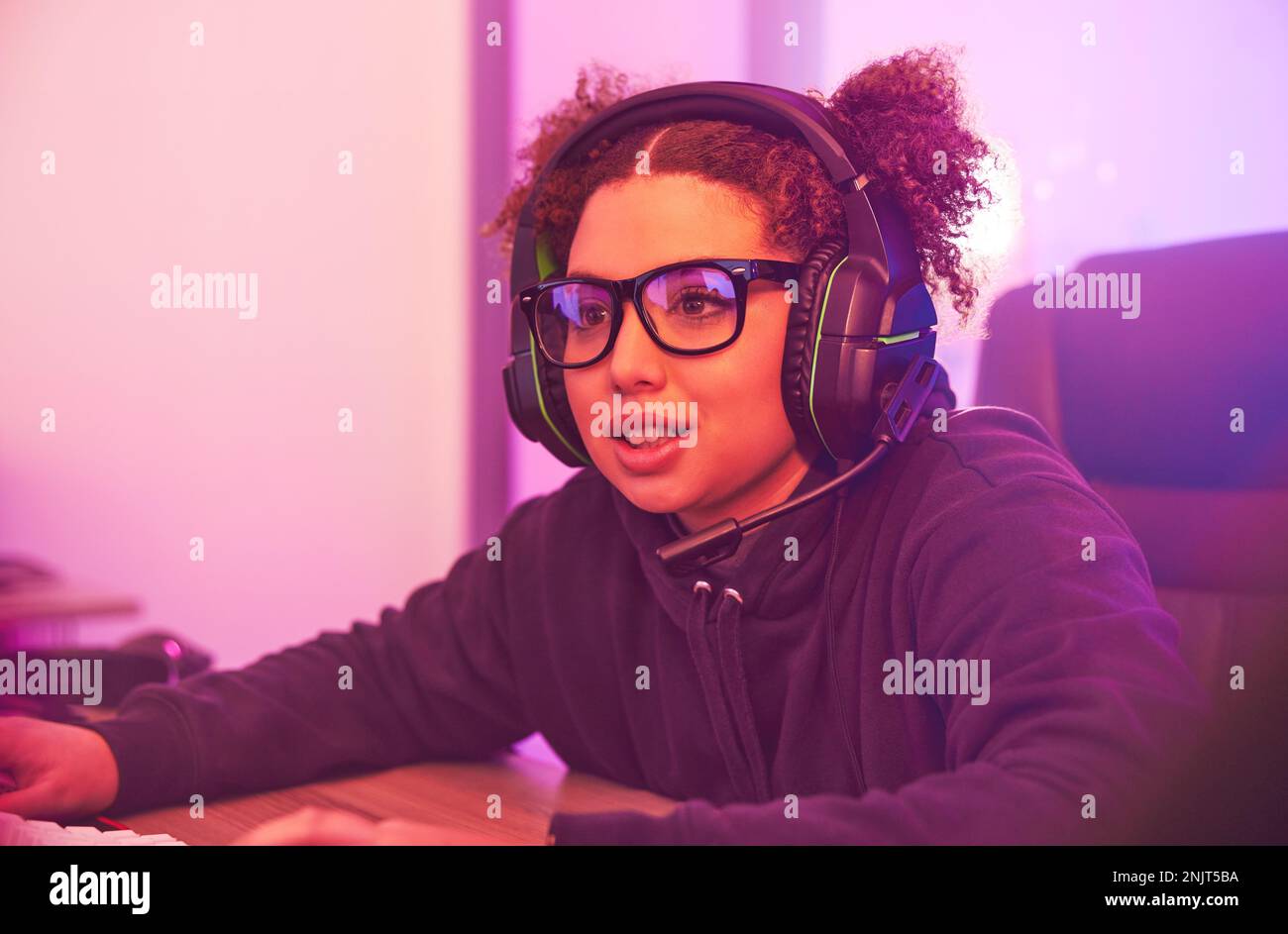 Video games, young girl and headset in home for esports, online rpg and ...