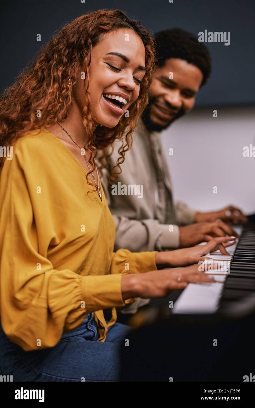 Friends, musicians and playing piano in studio album recording, night ...