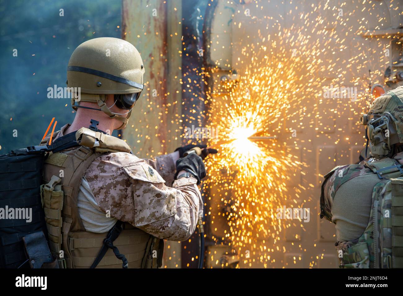 U.S. Marines and airmen attached to the Method of Entry School, Weapons ...